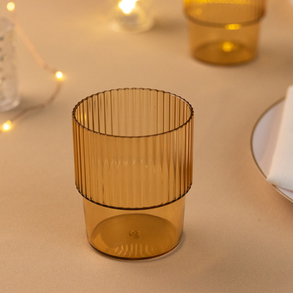 Ribbed Stackable Plastic Tumblers Amber Gold 7oz by TableclothsFactory.com