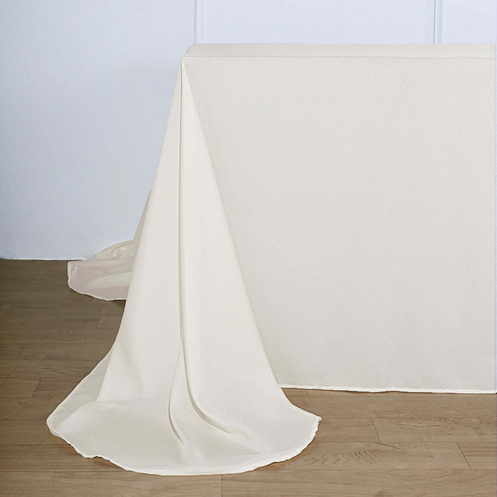 Polyester Oval Tablecloth 90"x156" Ivory | TableclothsFactory
